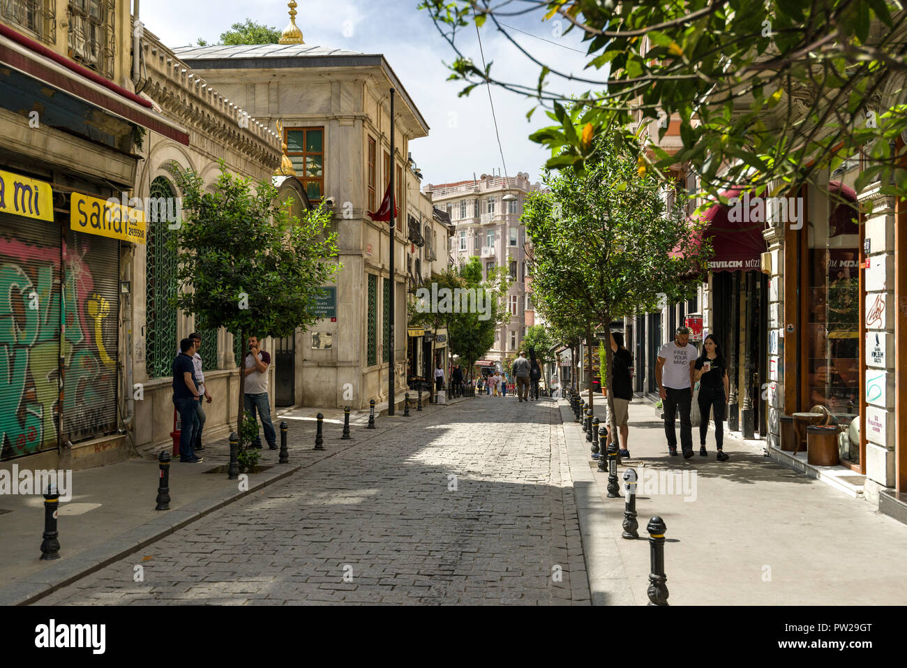 A typical street scene in the Beyoglu district of Istanbul with people ...