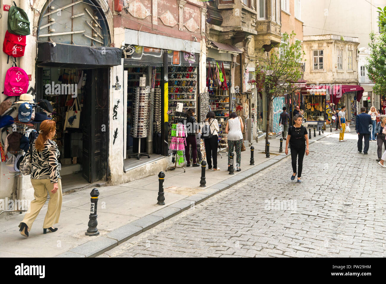 A typical street scene in the Beyoglu district of Istanbul with people ...