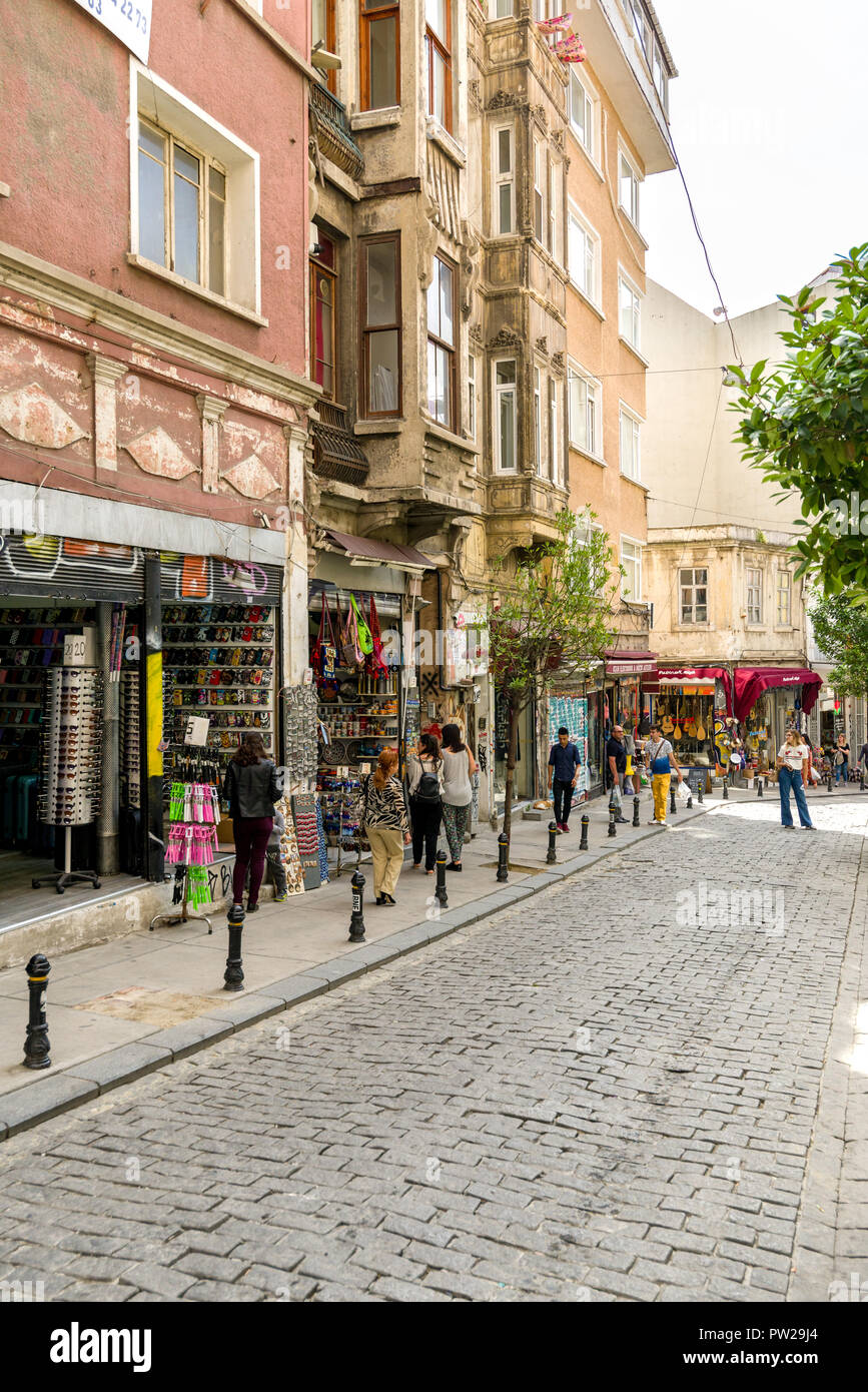 A typical street scene in the Beyoglu district of Istanbul with people ...