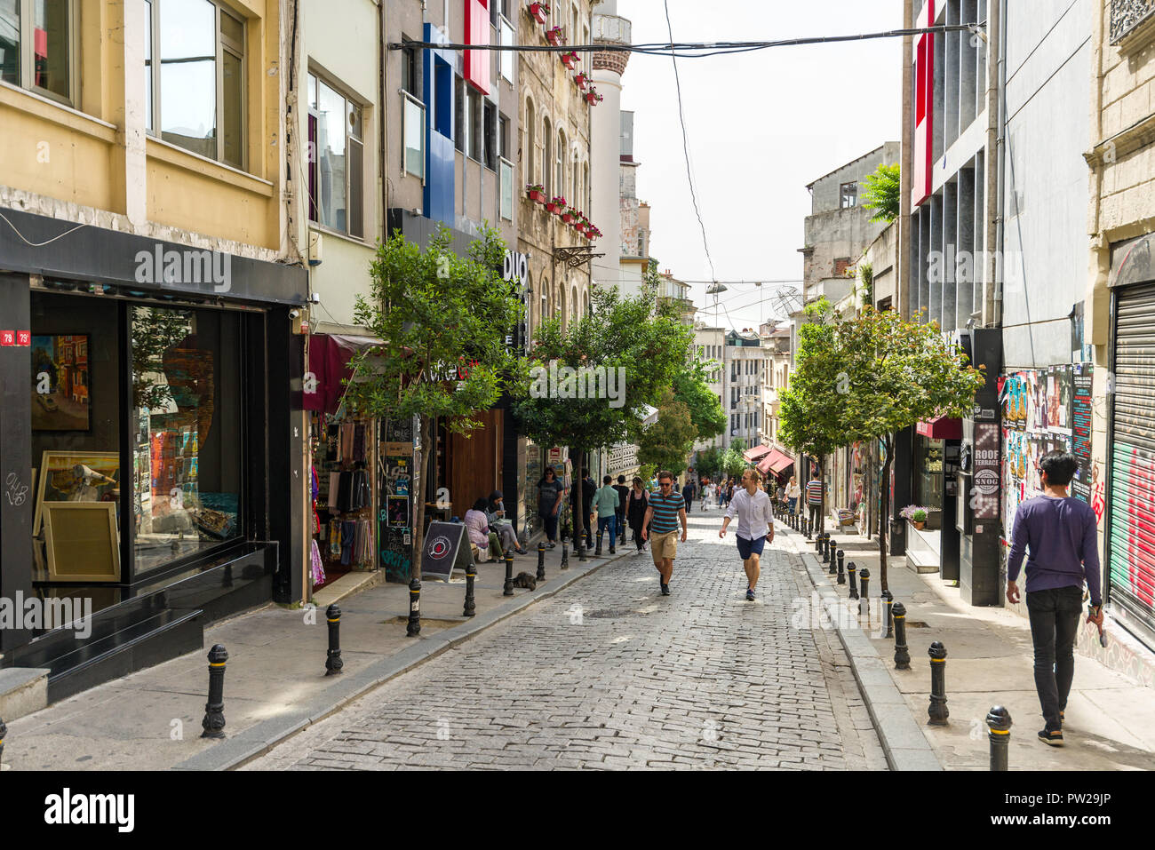 A typical street scene in the Beyoglu district of Istanbul with people ...