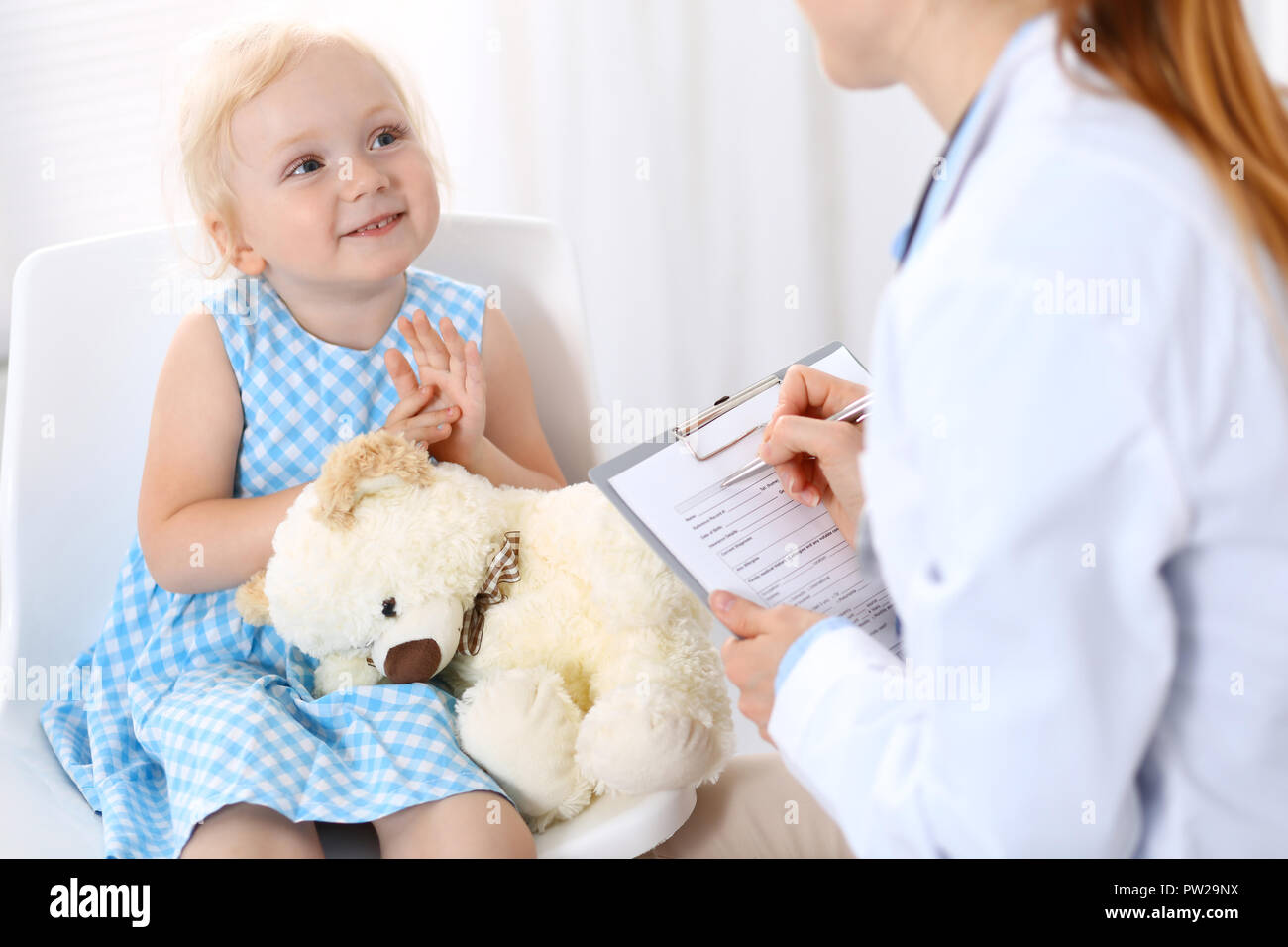 Doctor and a little blonde girl. Medicine and healthcare concept Stock ...