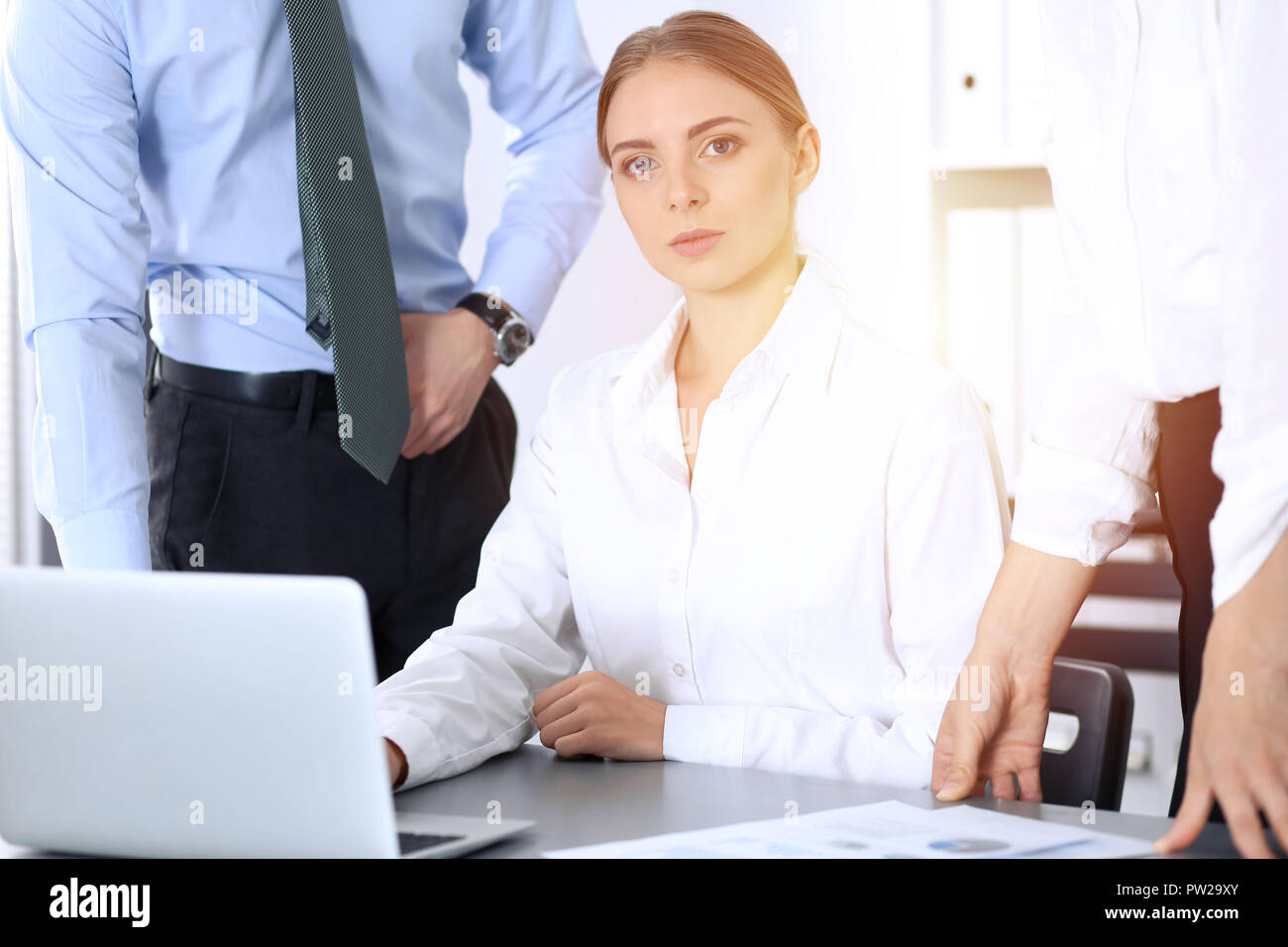 Group of business people using laptop computer in office. Meeting and ...