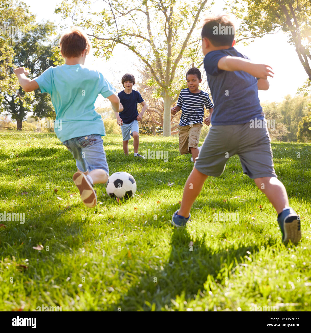 Asian kids playing football hi-res stock photography and images - Alamy