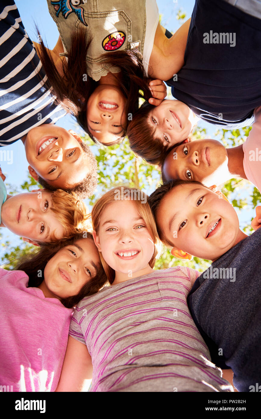 Group of kids outdoors looking down at camera,verticle Stock Photo - Alamy