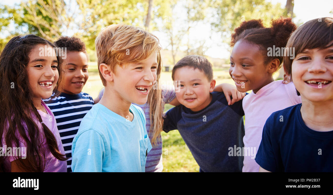 Multi-ethnic group of schoolchildren laughing, outdoors Stock Photo - Alamy Multi-ethnic group of schoolchildren laughing, outdoors Stock Photo - Alamy