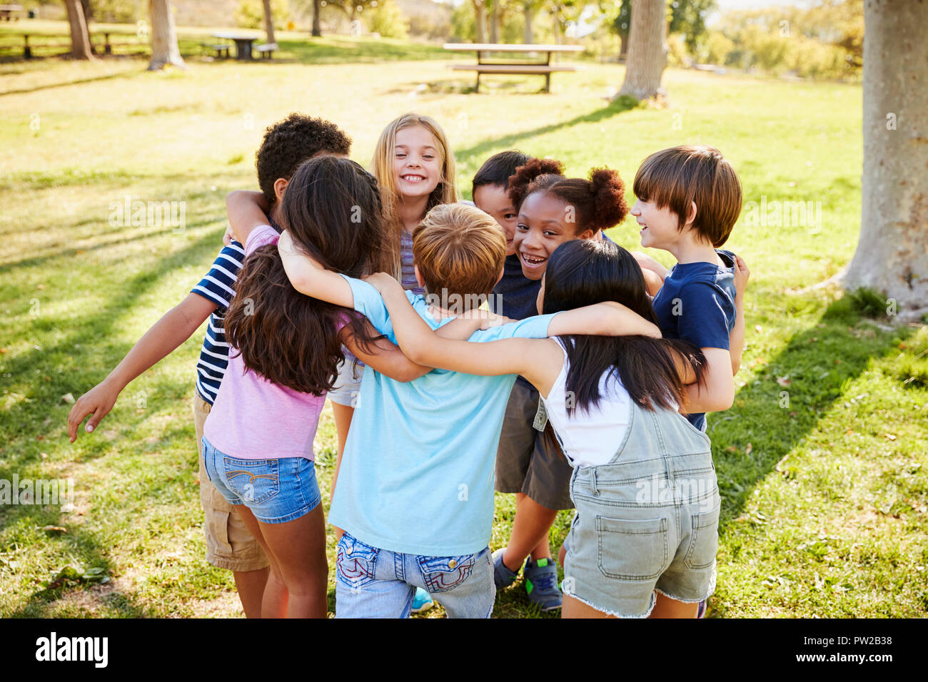 Happy kids huddle hi-res stock photography and images - Alamy