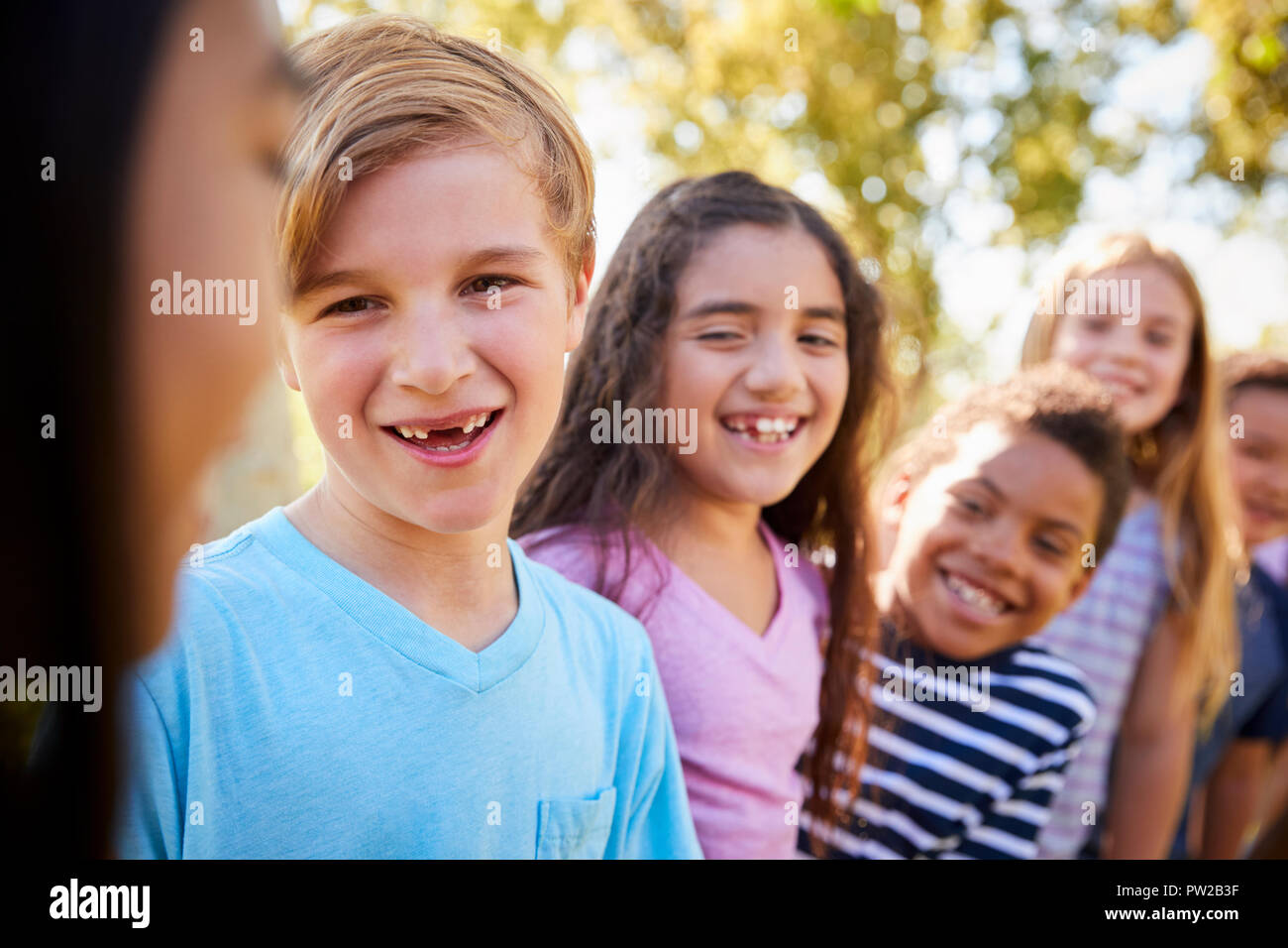 School kids hanging out together in a park Stock Photo - Alamy
