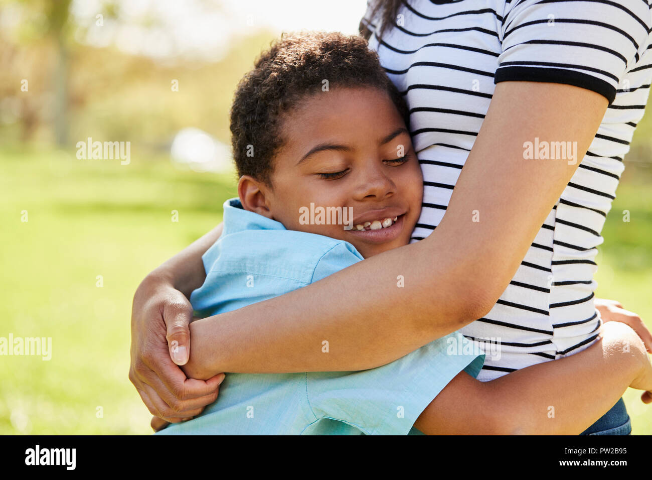 Mother hugging son hi-res stock photography and images - Alamy