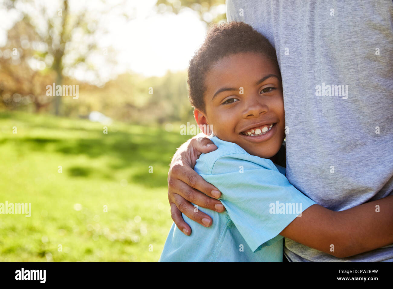 Close up father son hugging hi-res stock photography and images - Alamy