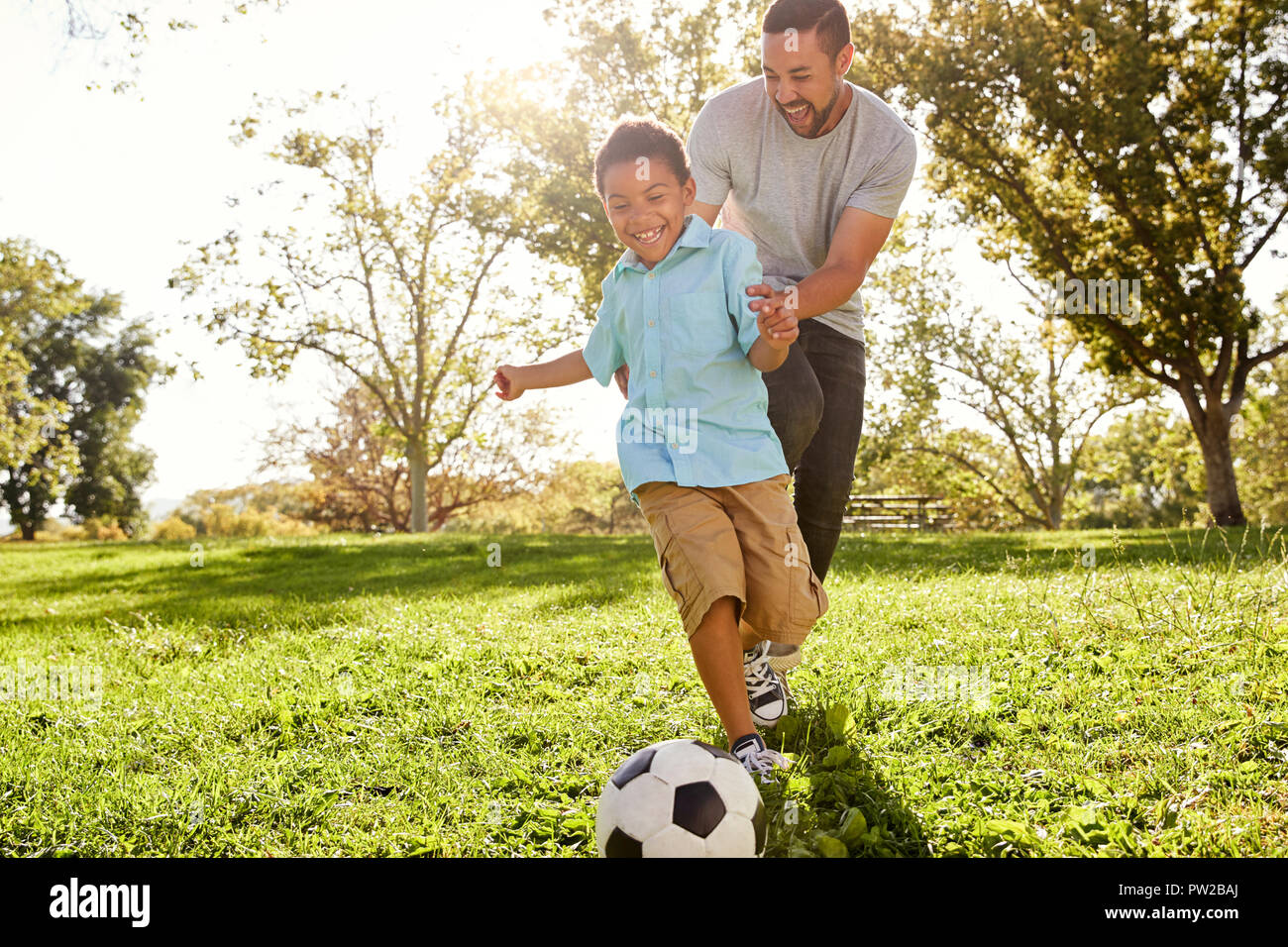 Black Father Son Playing Football High Resolution Stock Photography and ...