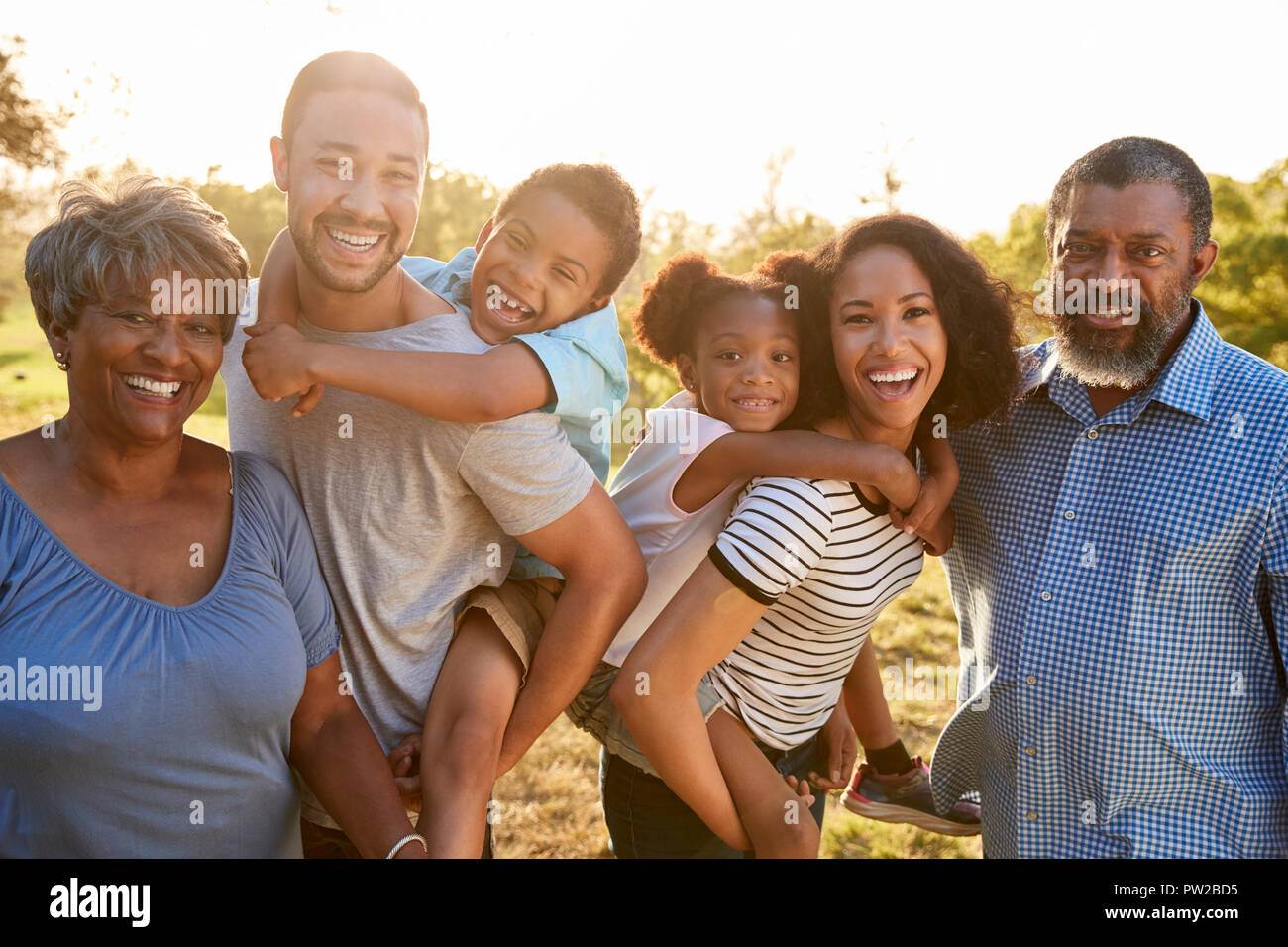 Portrait Of Multi Generation Family Enjoying Walk In Park Together ...
