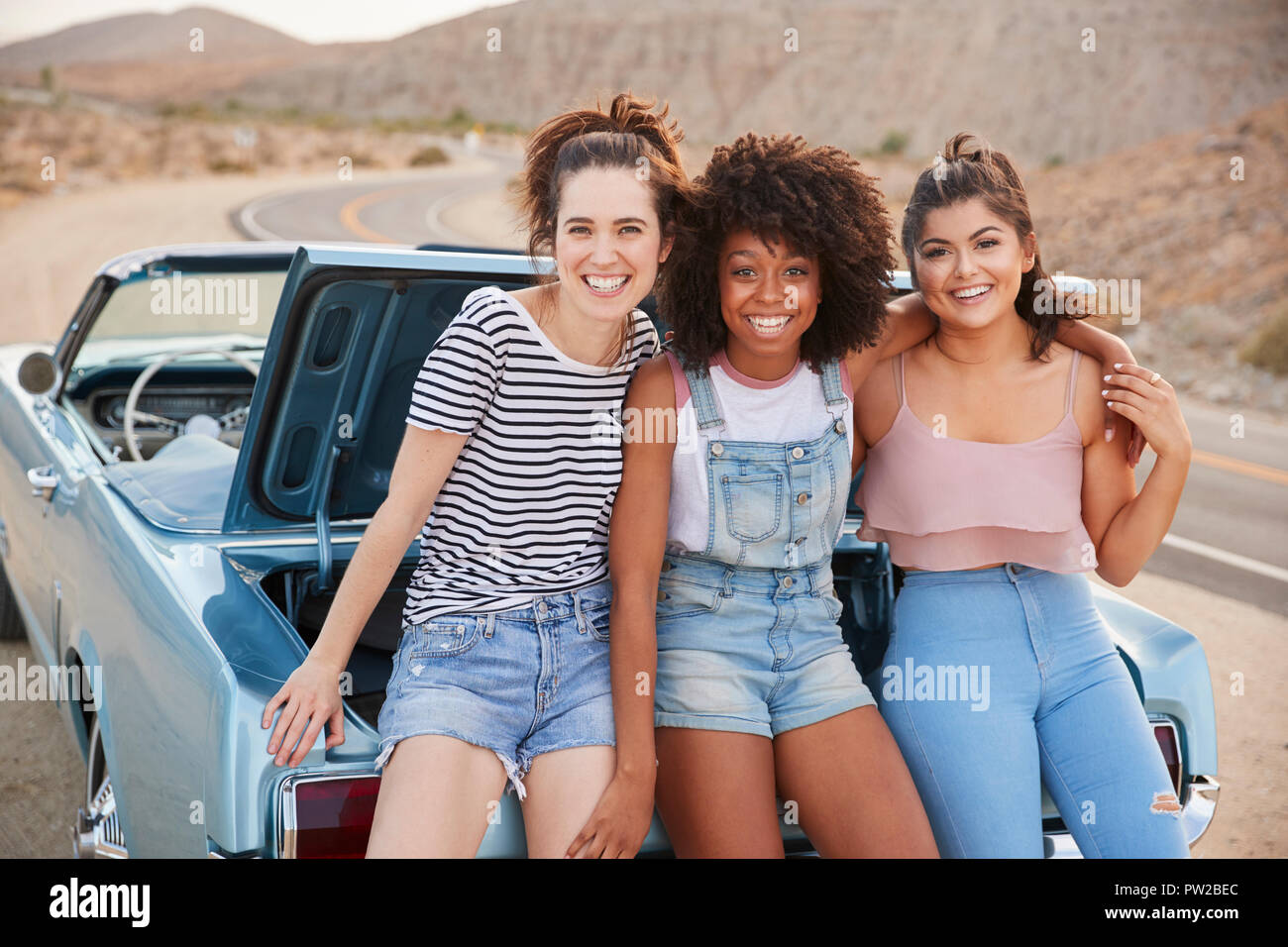 Three friends driving in convertible hi-res stock photography and ...