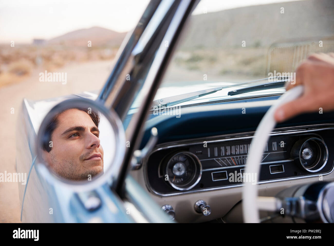 Classic car driving in desert hi-res stock photography and images - Alamy