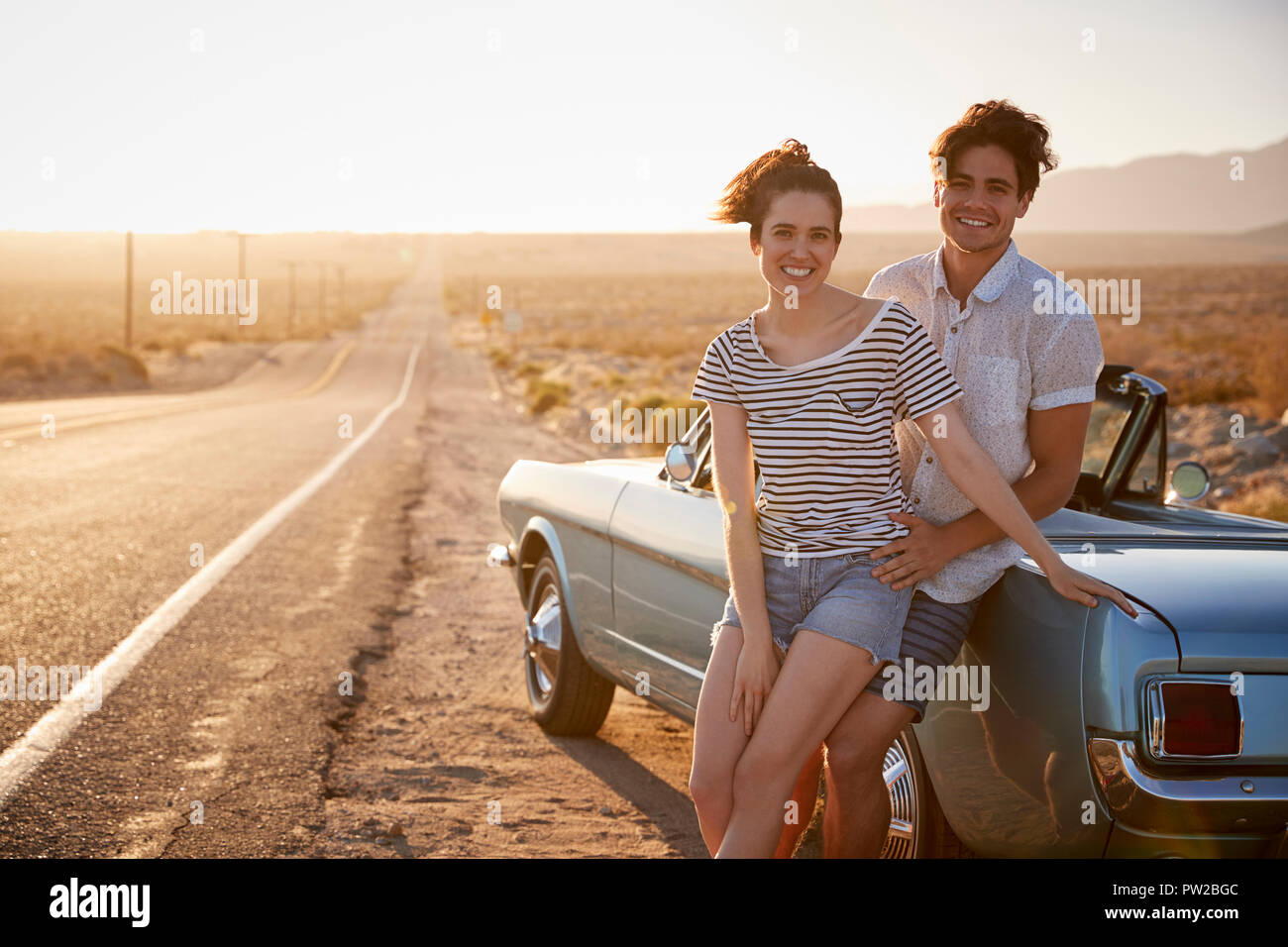Portrait Of Romantic Couple Enjoying Road Trip In Classic Car Stock ...