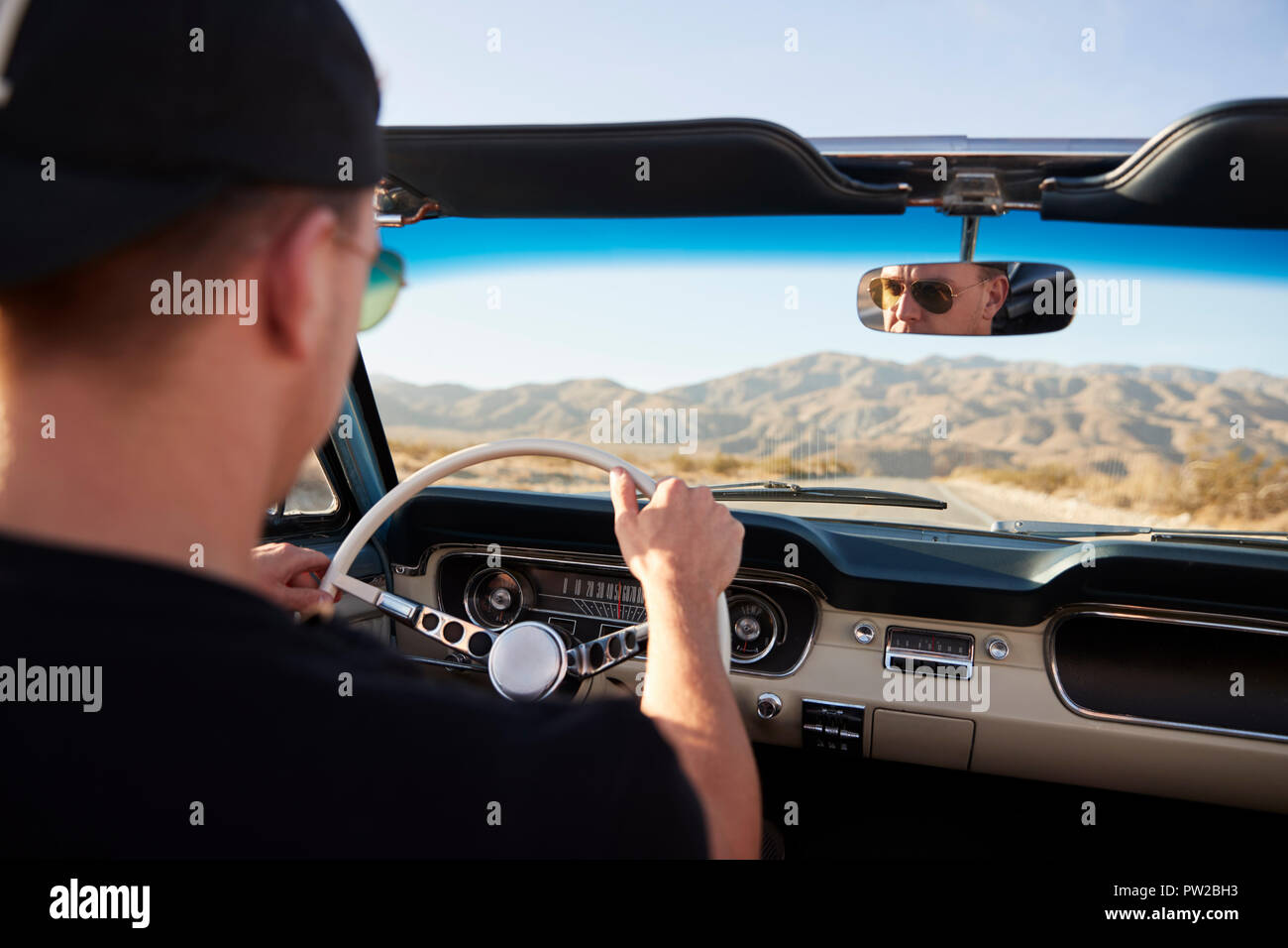 Car from behind driving into sunset hi-res stock photography and images ...