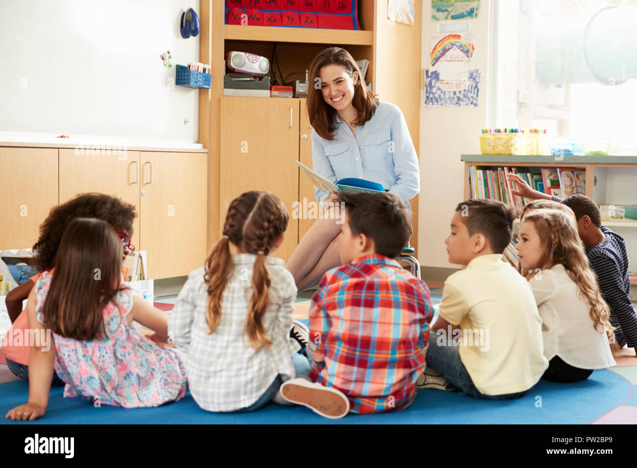 Woman Sitting Cross Legged In Chair High Resolution Stock Photography ...