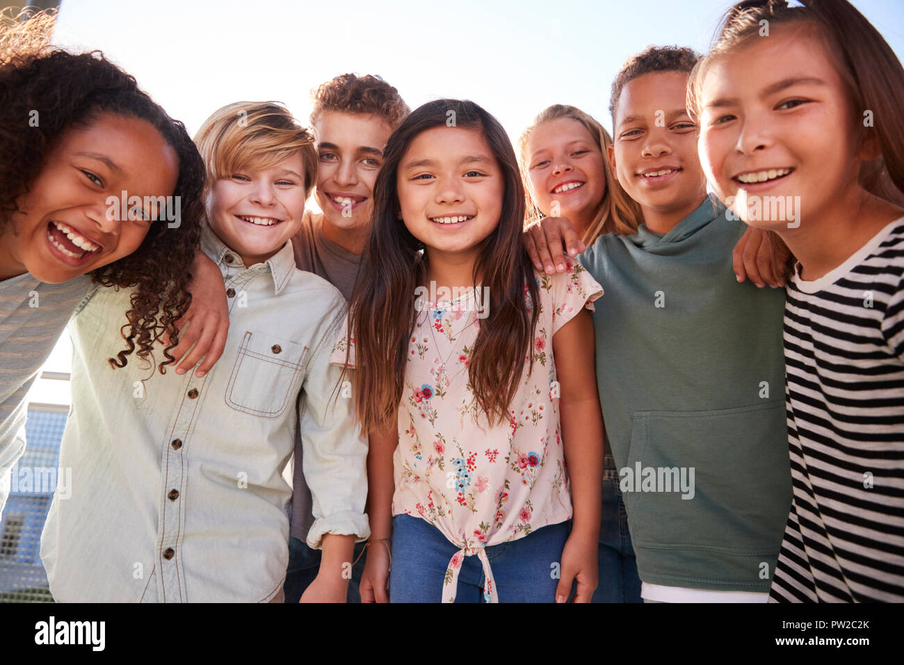 School kids hanging out during break, smiling to camera Stock Photo - Alamy