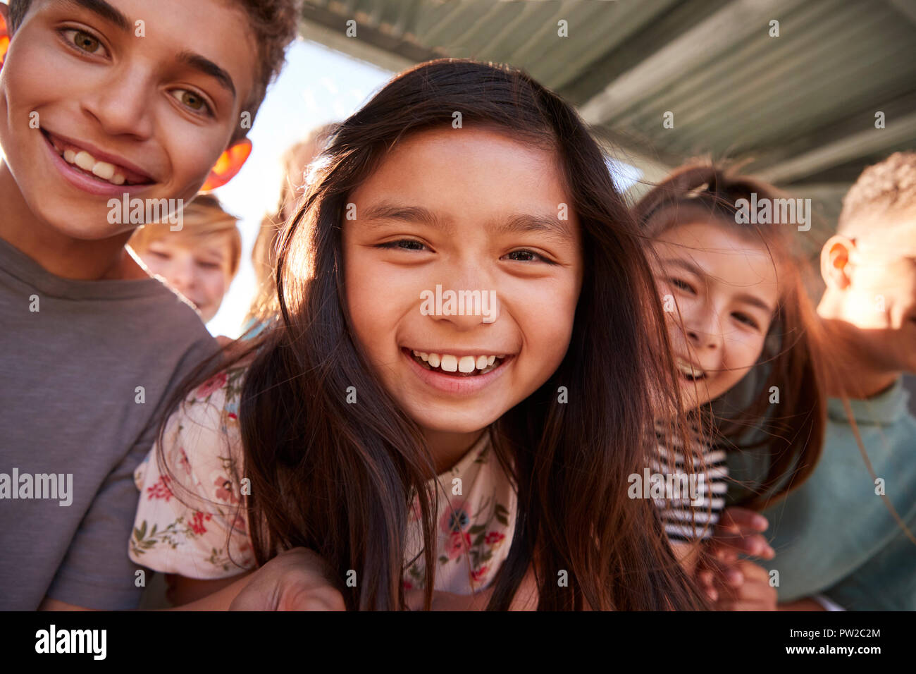 Elementary school kids smiling to camera, close up Stock Photo - Alamy