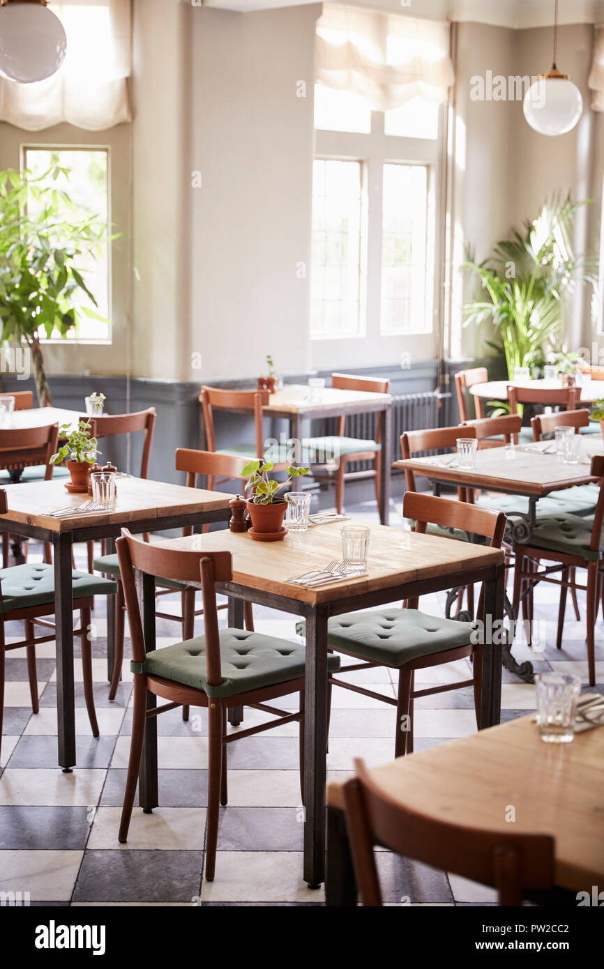 Tables Laid For Service In Empty Restaurant Stock Photo - Alamy