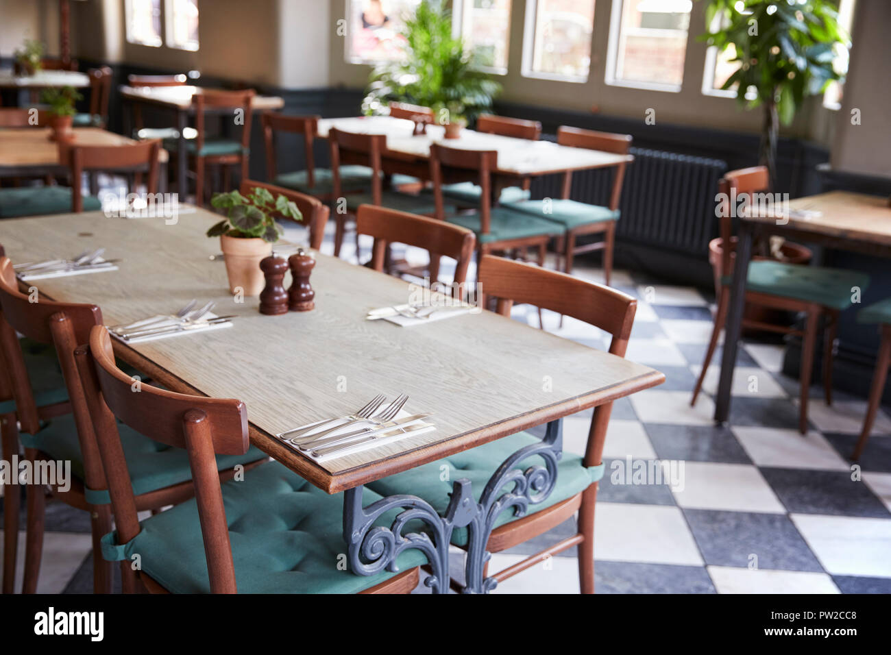 Tables Laid For Service In Empty Restaurant Stock Photo - Alamy