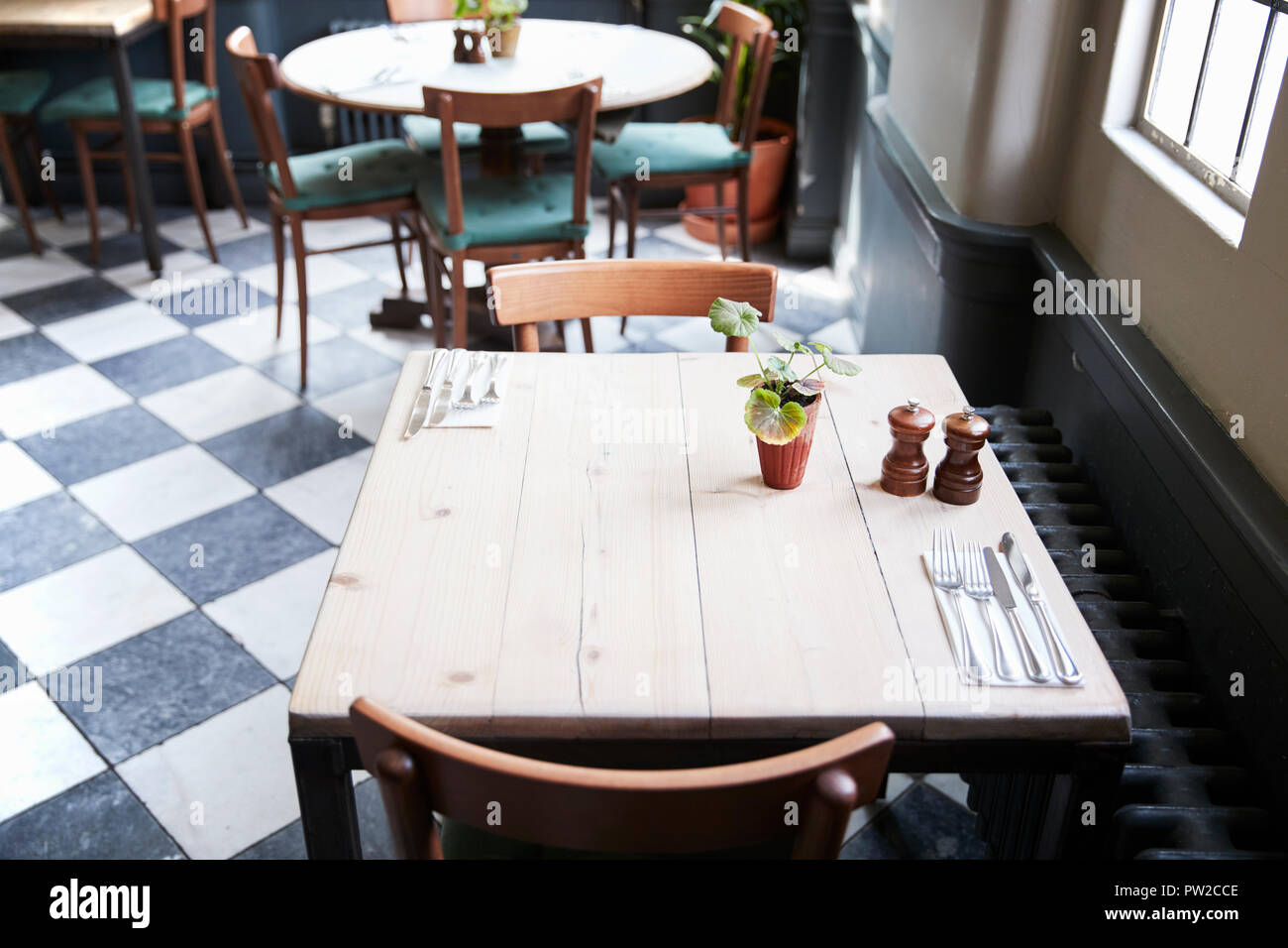 Tables Laid For Service In Empty Restaurant Stock Photo - Alamy