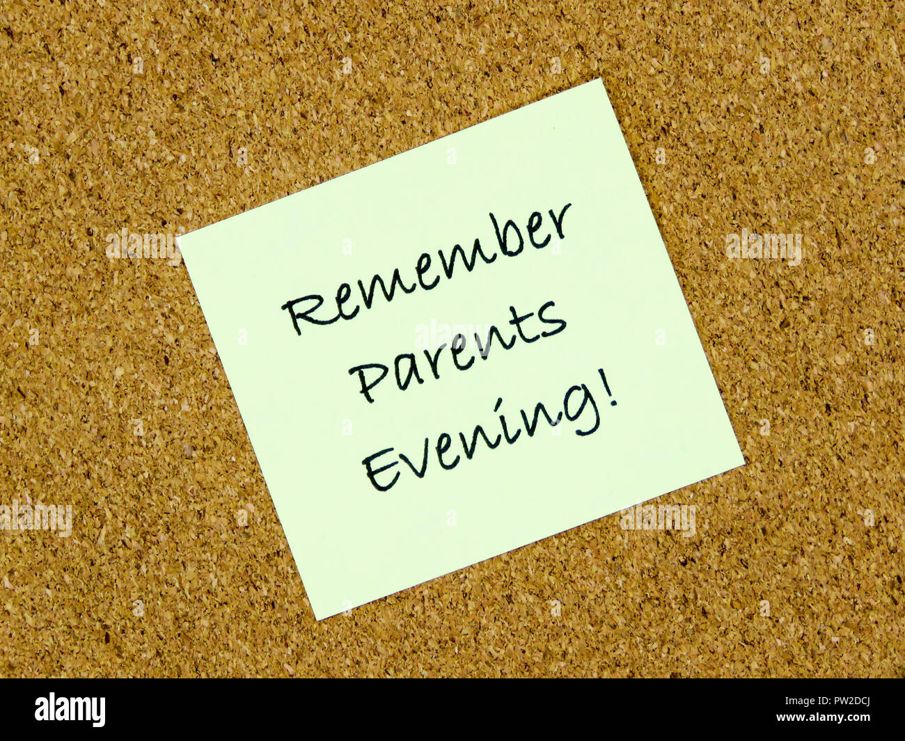 A yellow sticky note with remember parents evening written on it on a ...