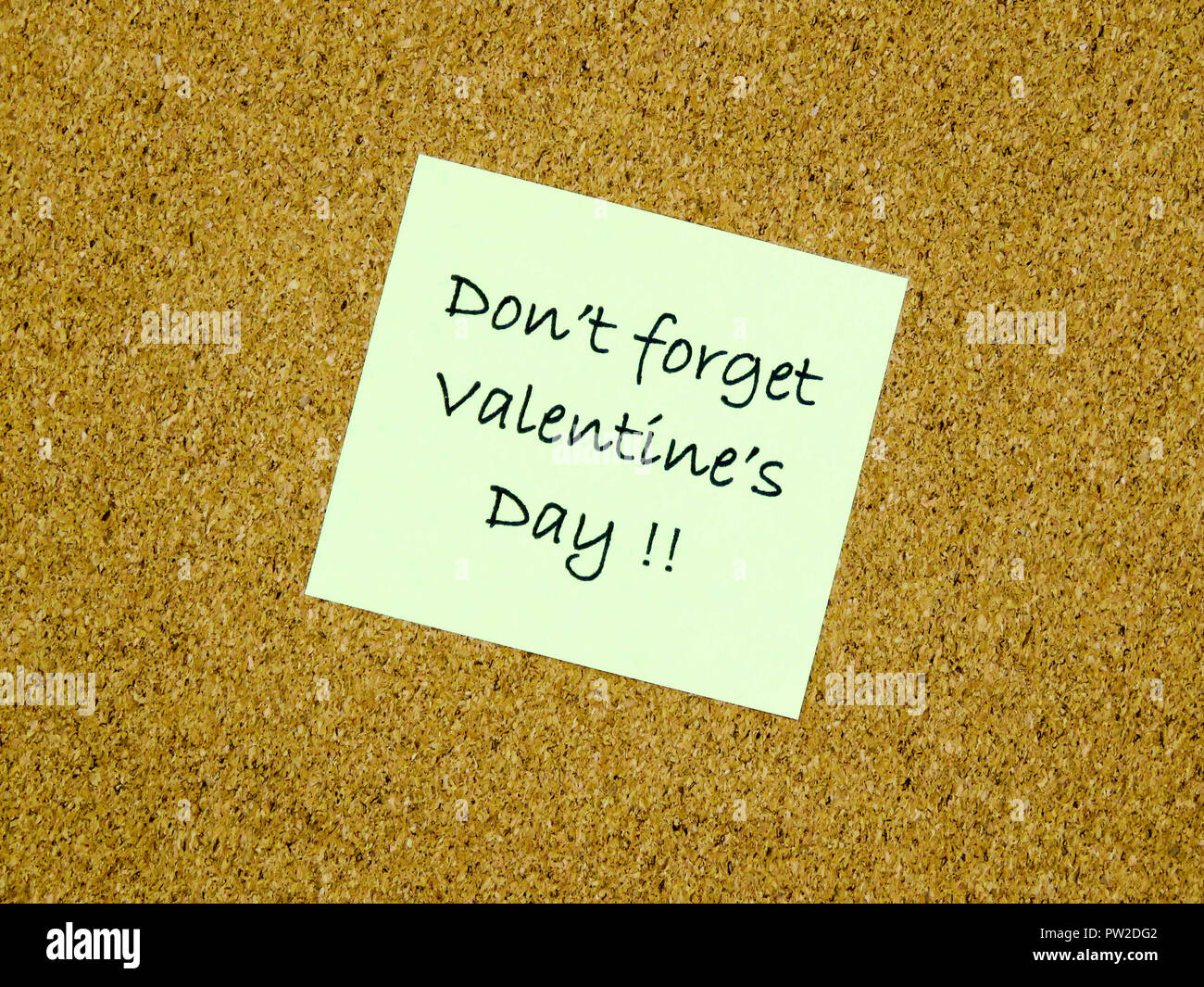 A yellow sticky note with don't forget valentines day written on it on ...