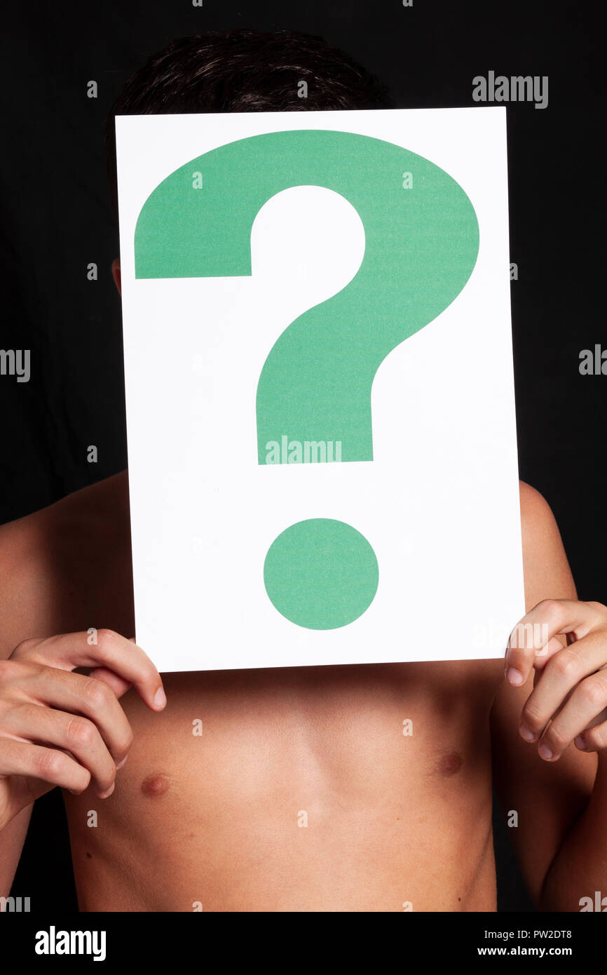 boy holding a question mark Stock Photo - Alamy