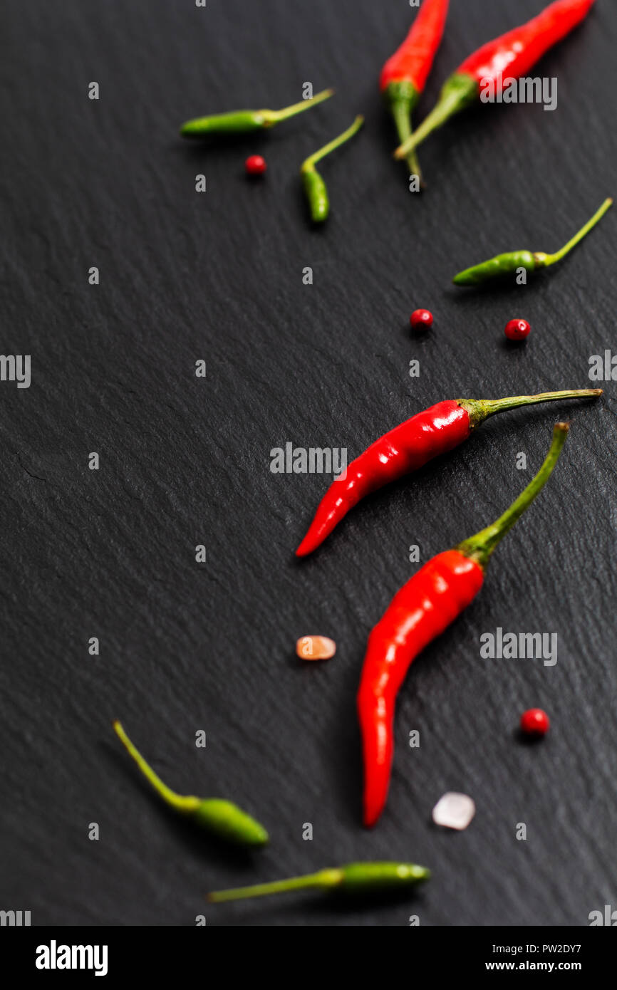 Food spicy presentation background red chili and green chili on black ...