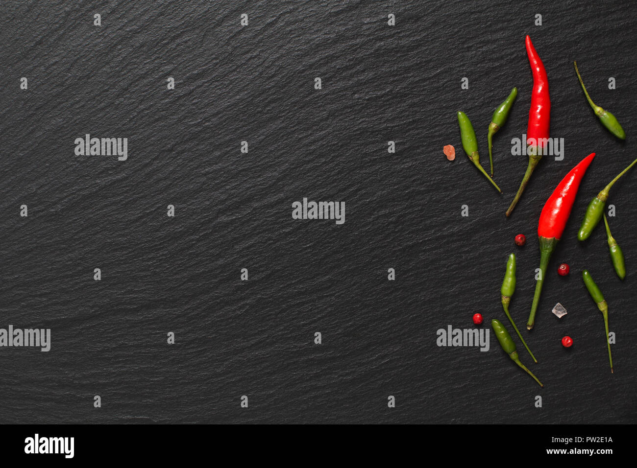 Food spicy presentation background red chili and green chili on black ...