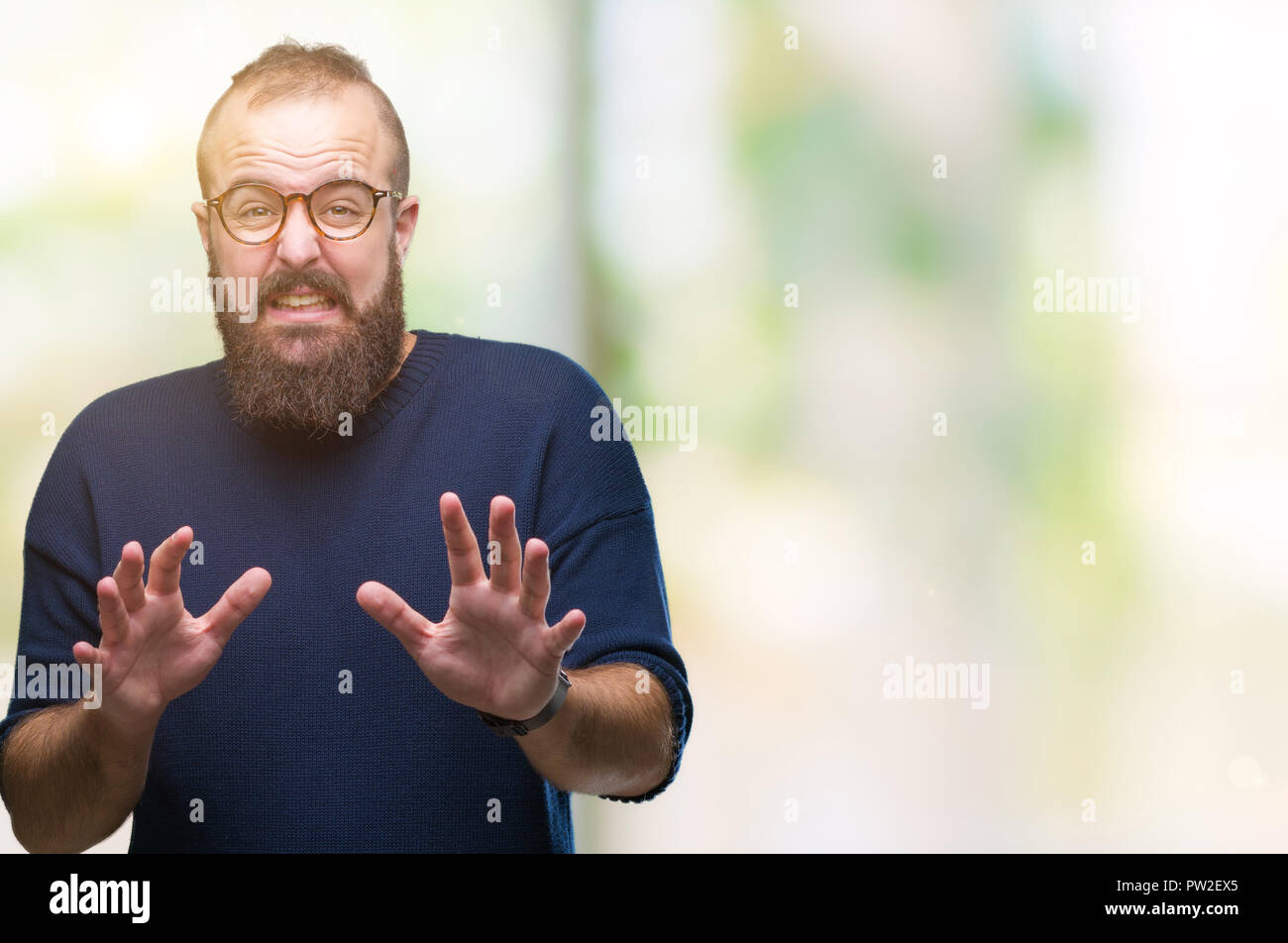 Young caucasian hipster man wearing sunglasses over isolated background ...