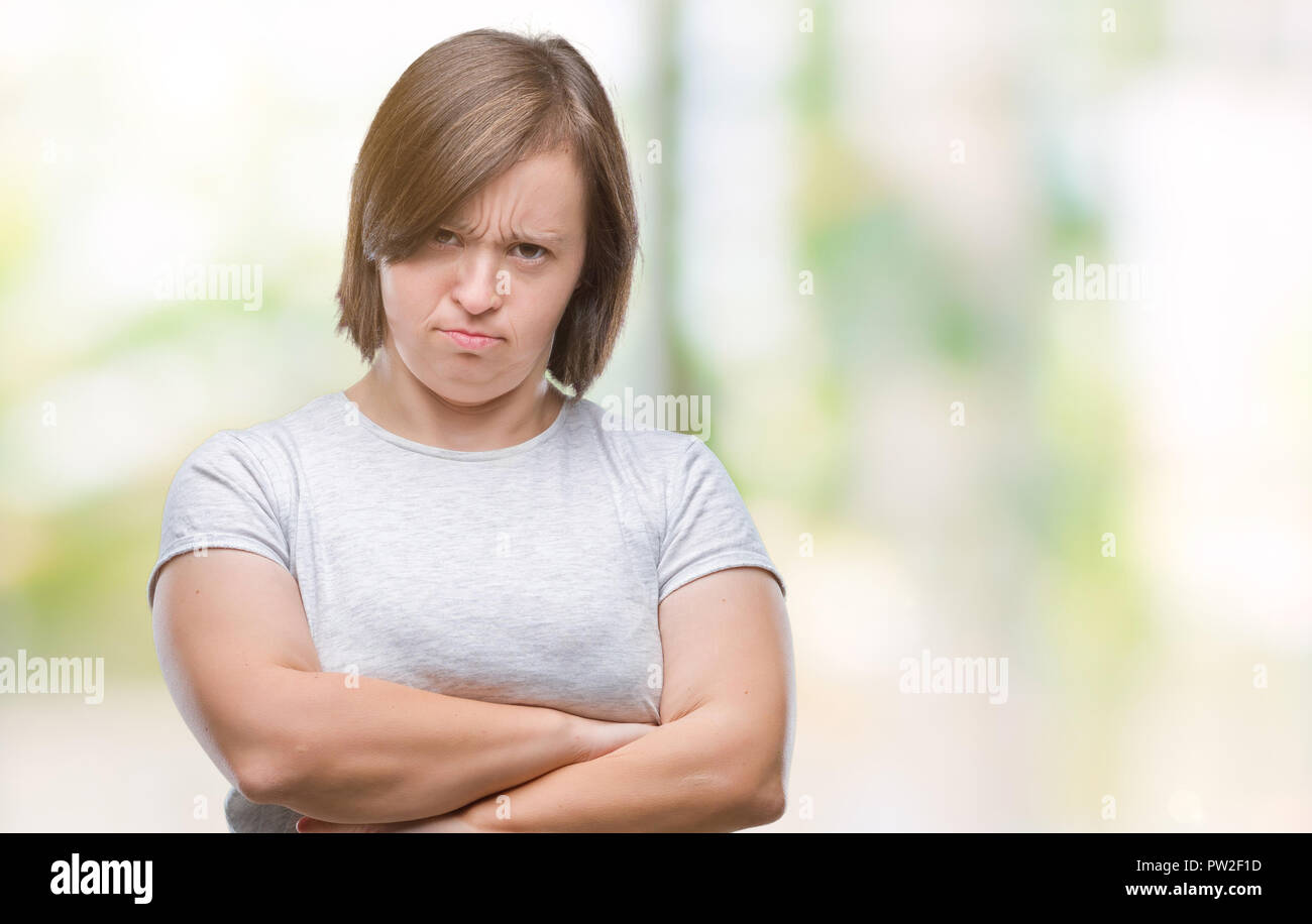 Young adult woman with down syndrome over isolated background skeptic ...