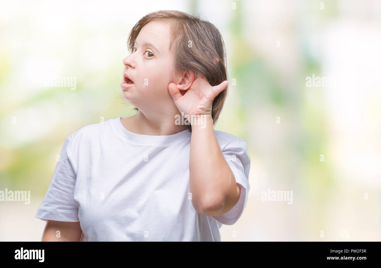 Young adult woman with down syndrome over isolated background smiling ...