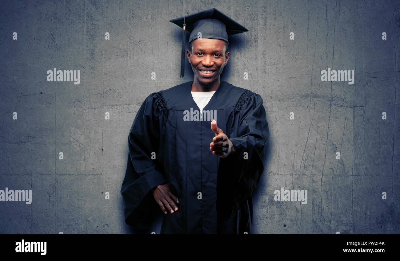 Young african graduate student black man holds hands welcoming in ...