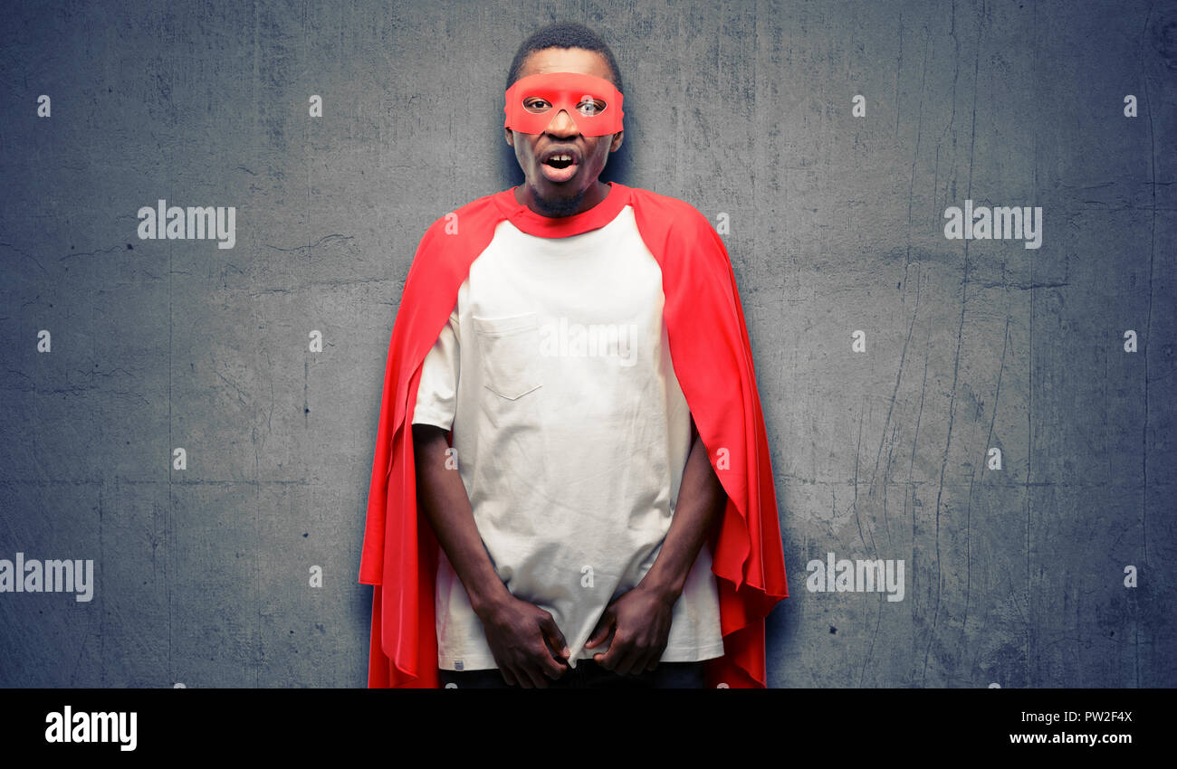 African black super hero man scared in shock, expressing panic and fear ...