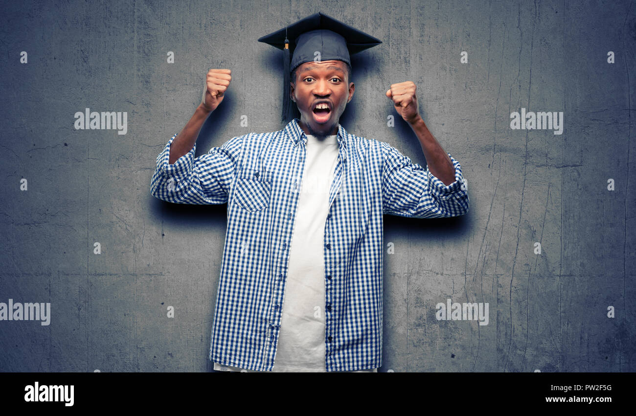 Young african graduate student black man happy and excited celebrating ...
