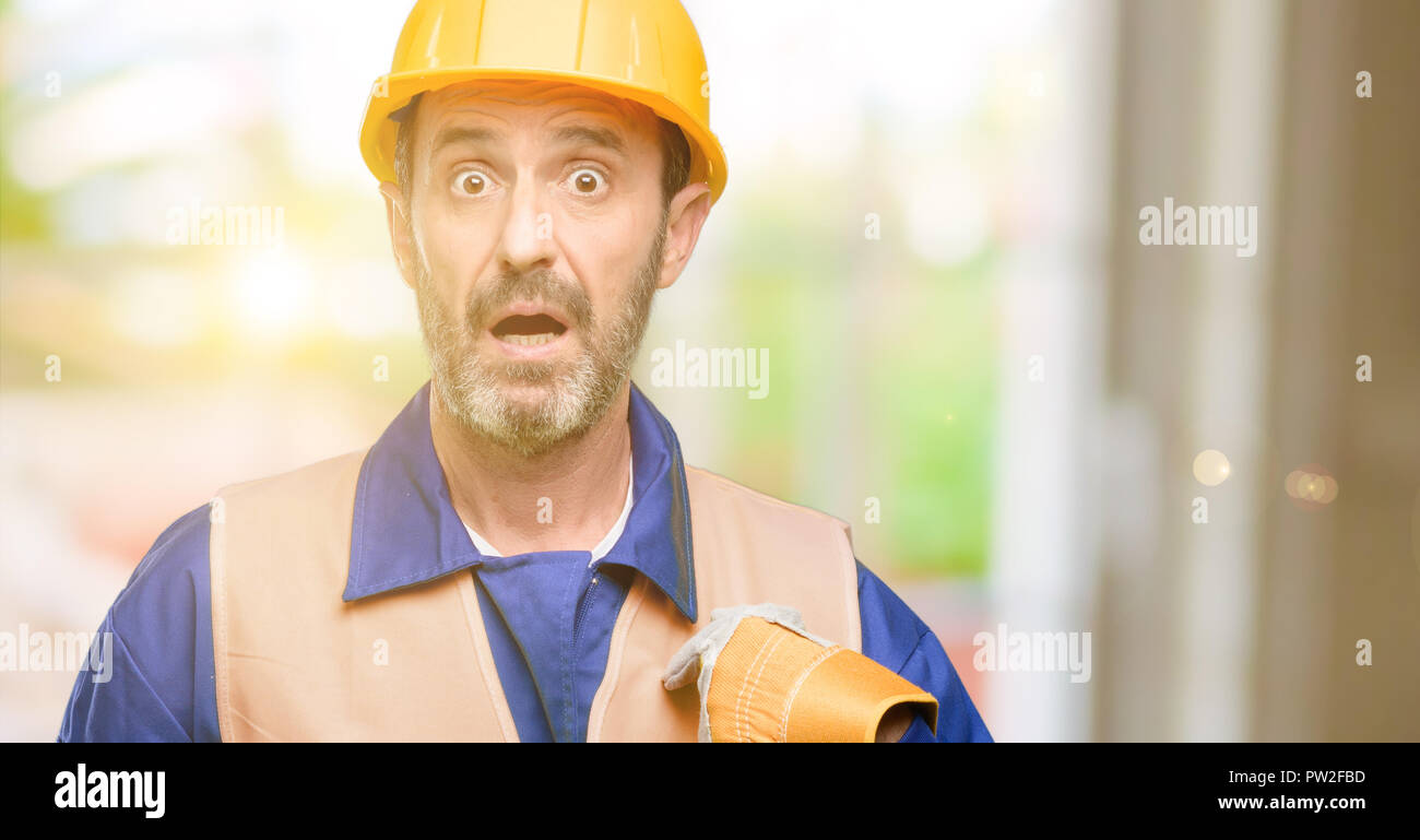 Senior engineer man, construction worker happy and surprised cheering ...