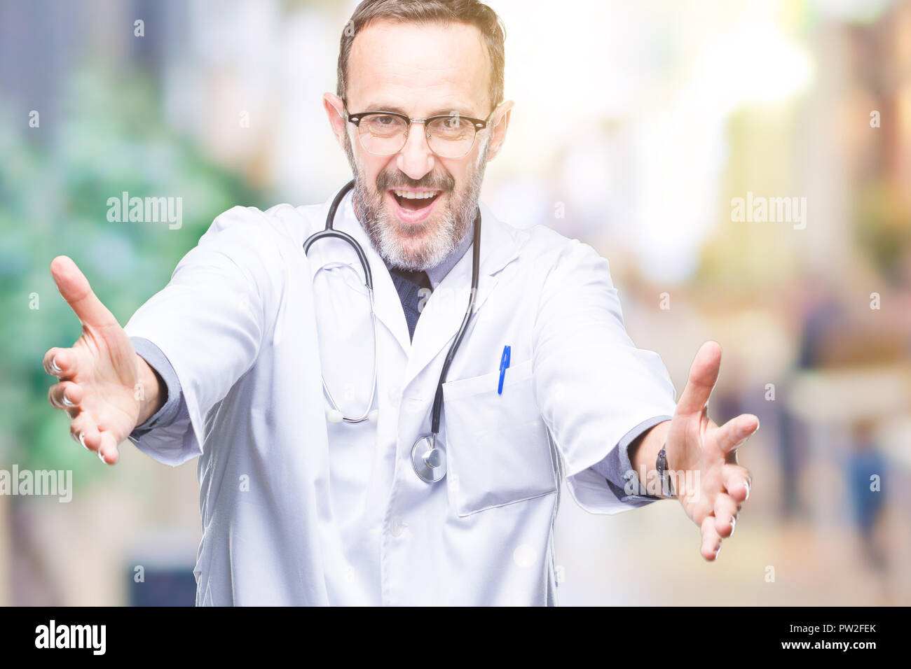 Middle age senior hoary doctor man wearing medical uniform isolated ...