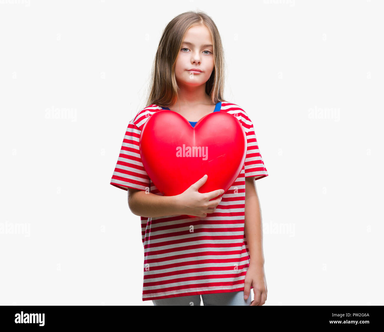 Young beautiful girl holding red heart over isolated background with a ...