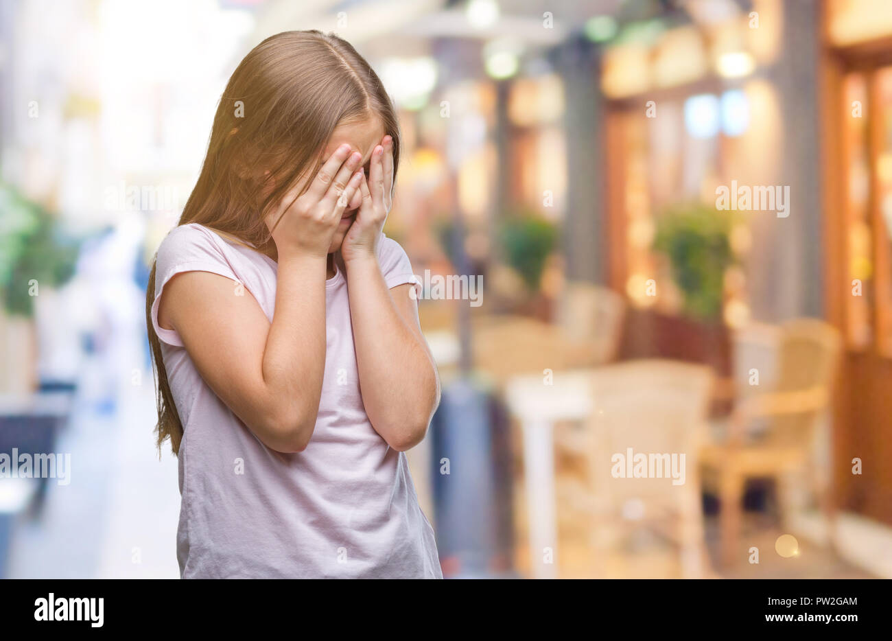 Young beautiful girl over isolated background with sad expression ...