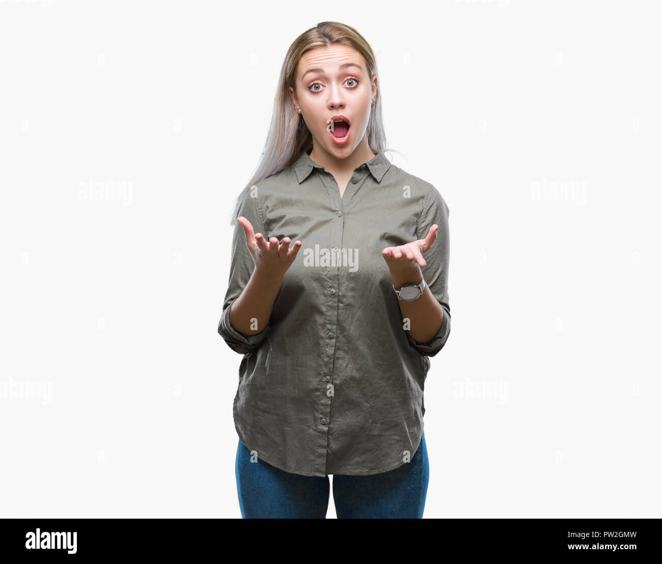 Young blonde business woman over isolated background afraid and shocked ...