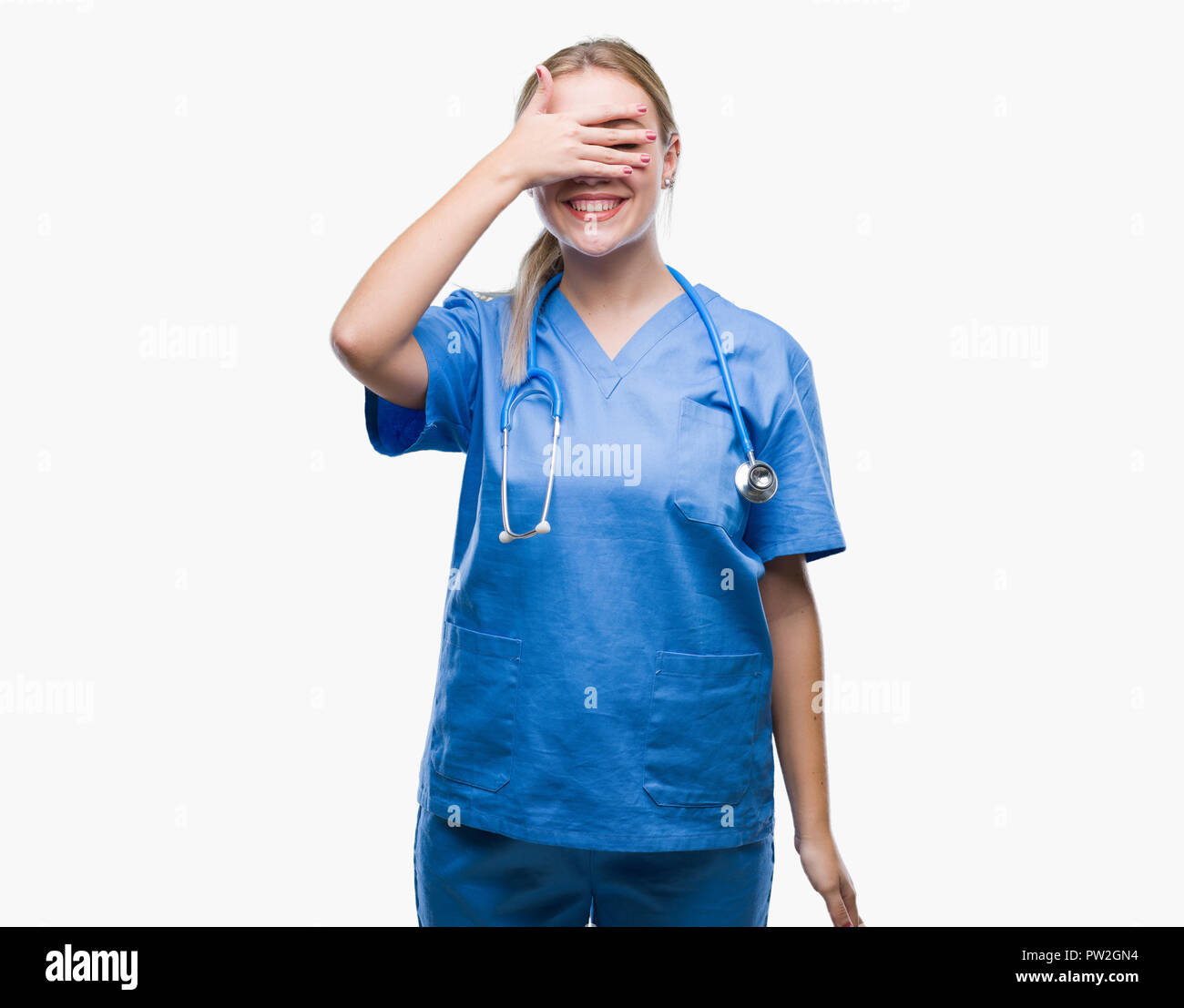 Young blonde surgeon doctor woman over isolated background smiling and ...