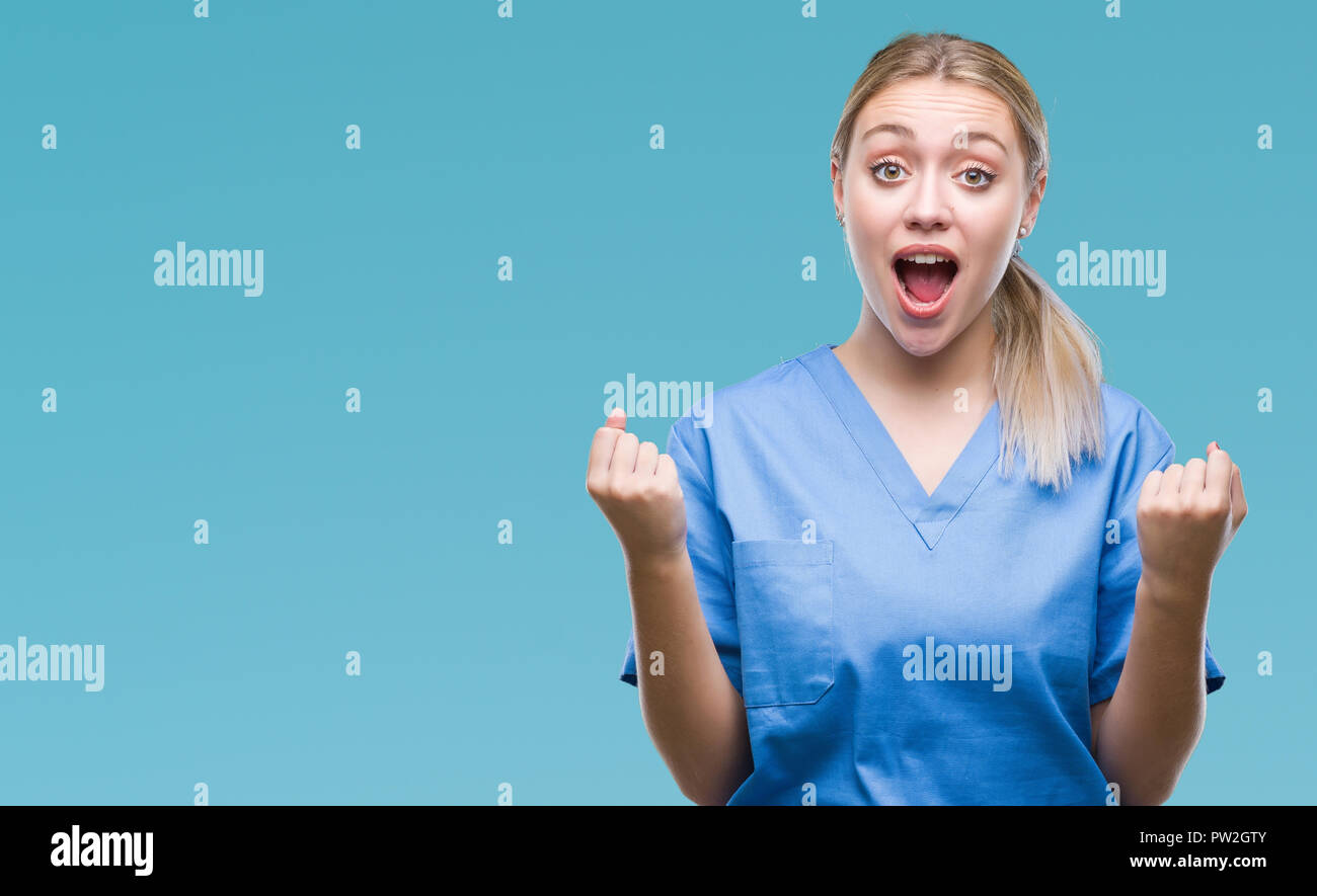 Young blonde surgeon doctor woman wearing medical uniform over isolated ...