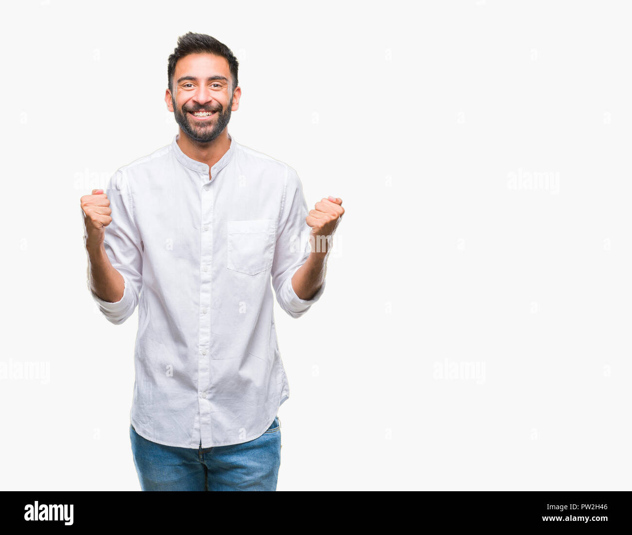 Adult hispanic man over isolated background celebrating surprised and ...