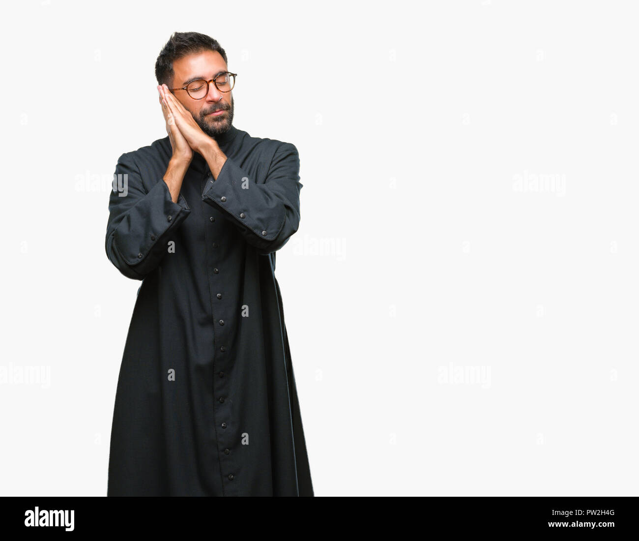 Adult hispanic catholic priest man over isolated background sleeping ...