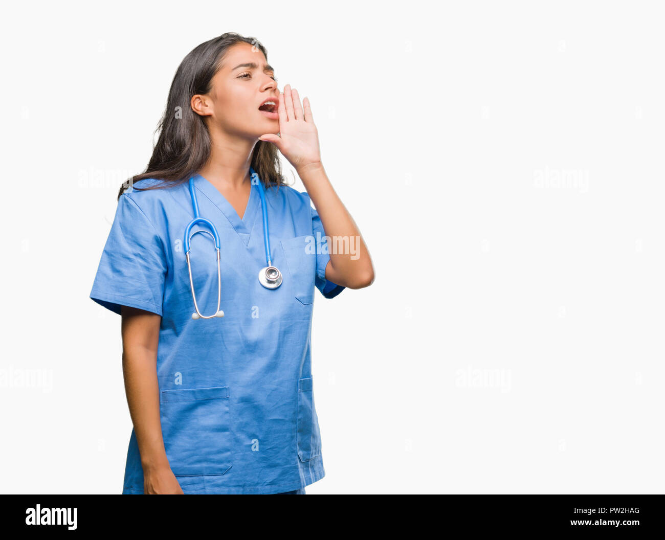 Young arab doctor surgeon woman over isolated background shouting and ...