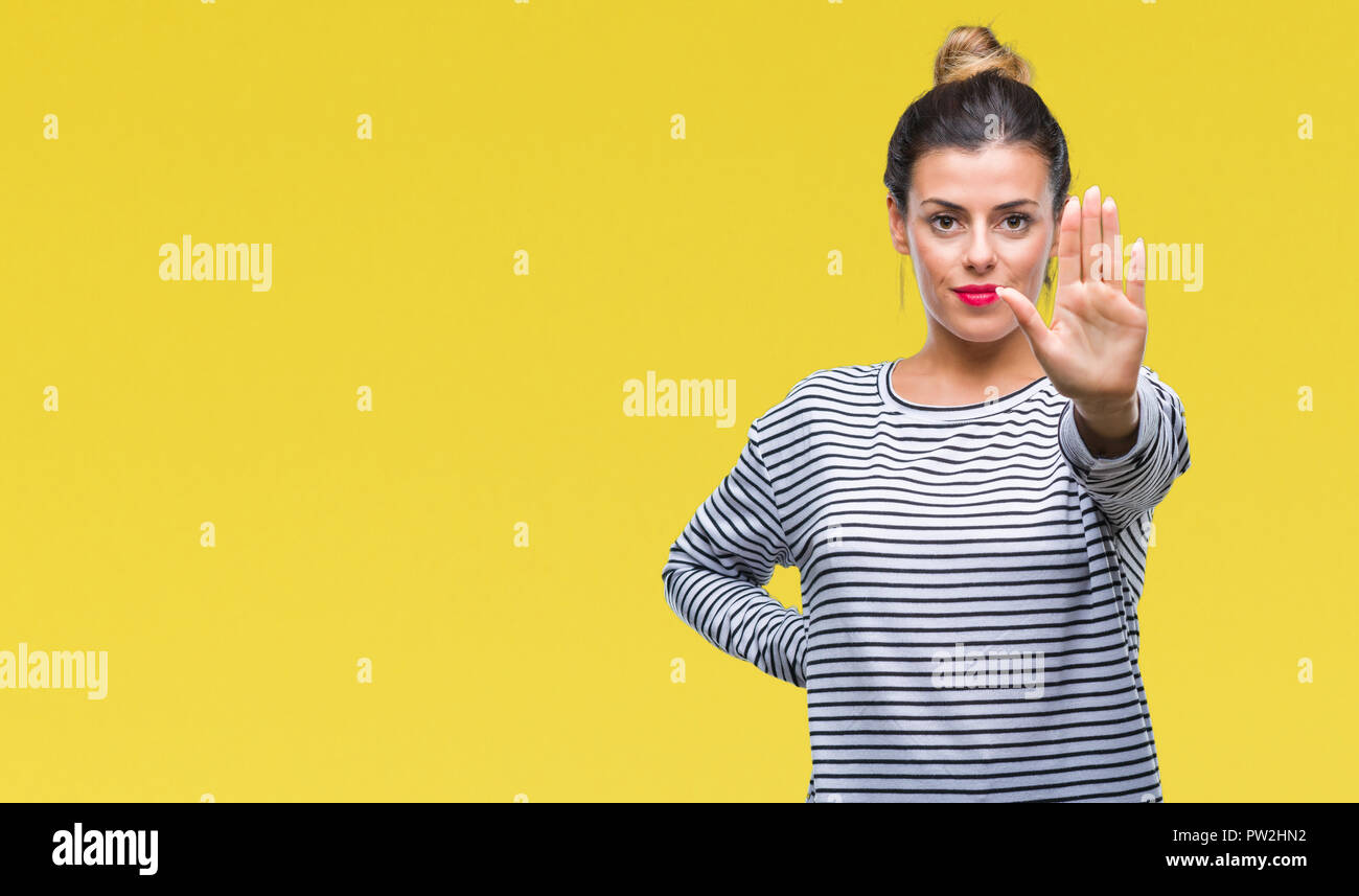 Young beautiful woman casual stripes sweater over isolated background ...