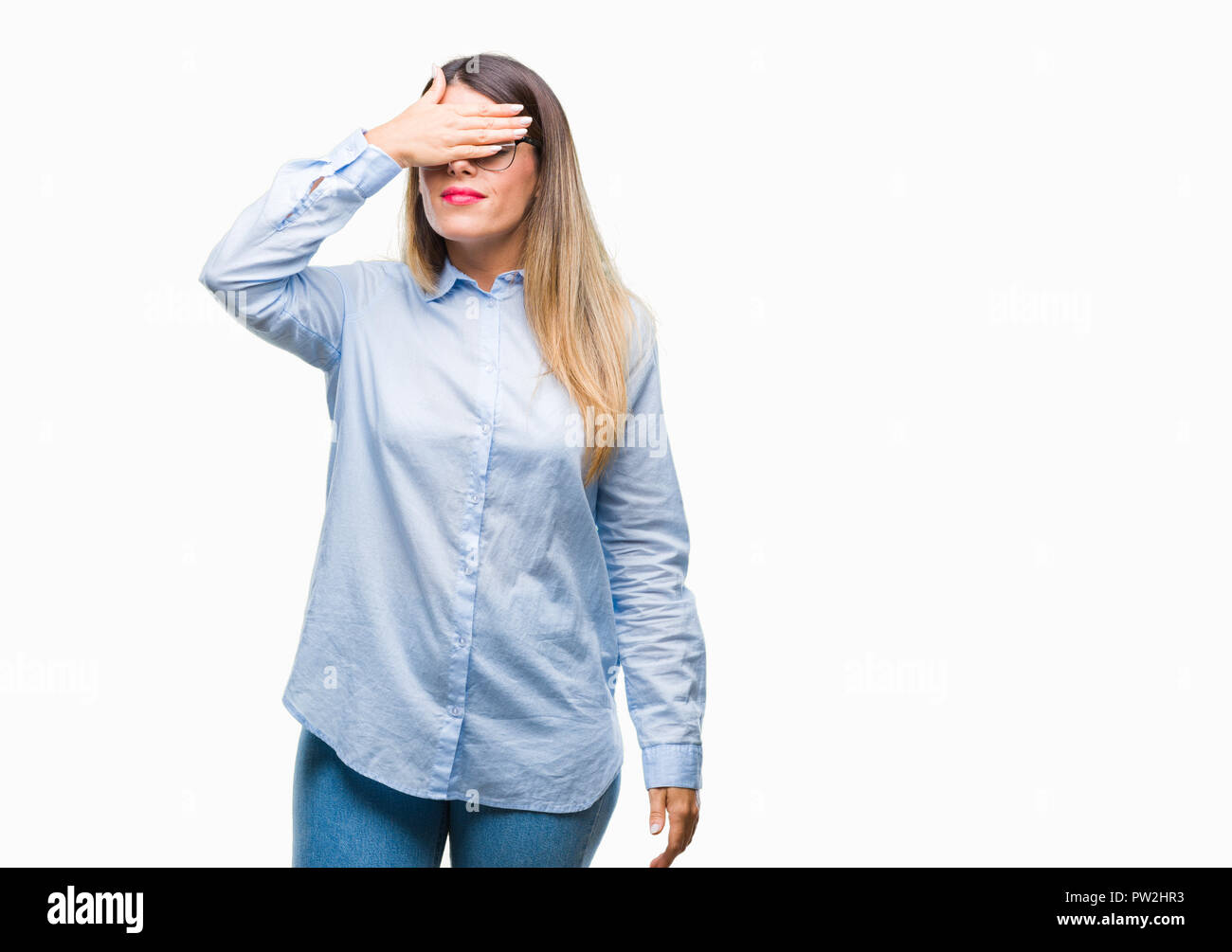 Young beautiful business woman wearing glasses over isolated background ...