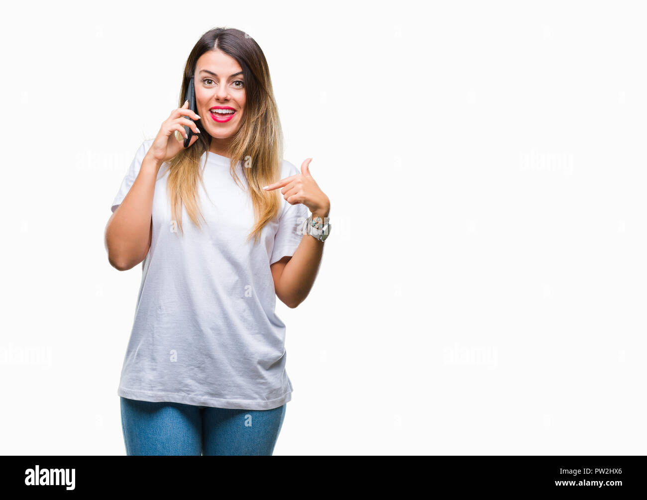 Young beautiful woman speaking calling using smartphone over isolated ...