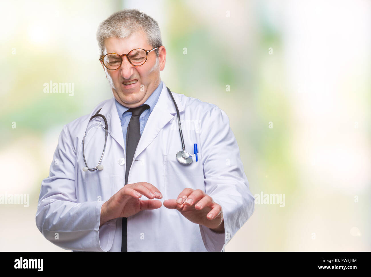 Handsome senior doctor man over isolated background disgusted ...